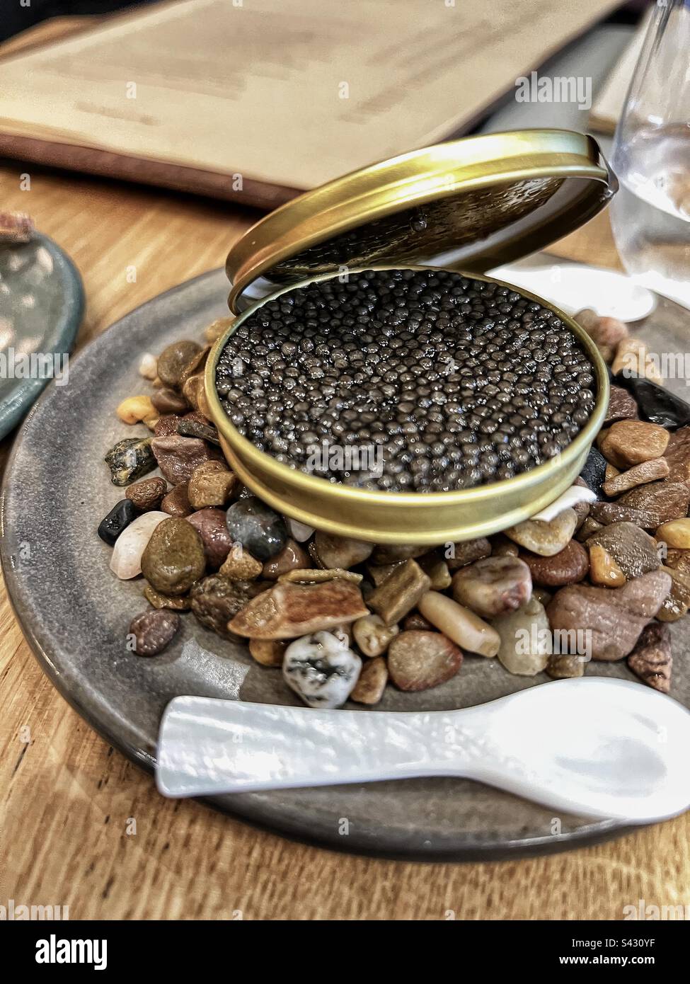 Open caviar tin Stock Photo - Alamy