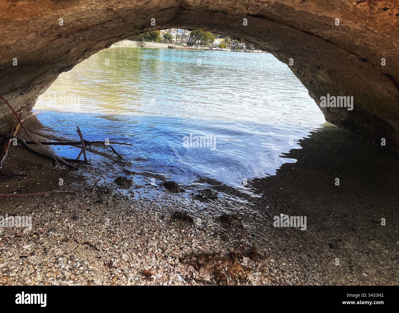 Under the arch of the jetty at Platja d'Albercuix or d'Albercutx near ...