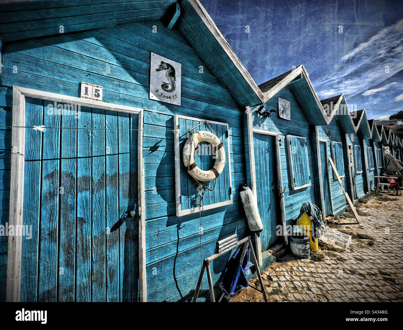 Fishing Shacks on the beach Stock Photo - Alamy