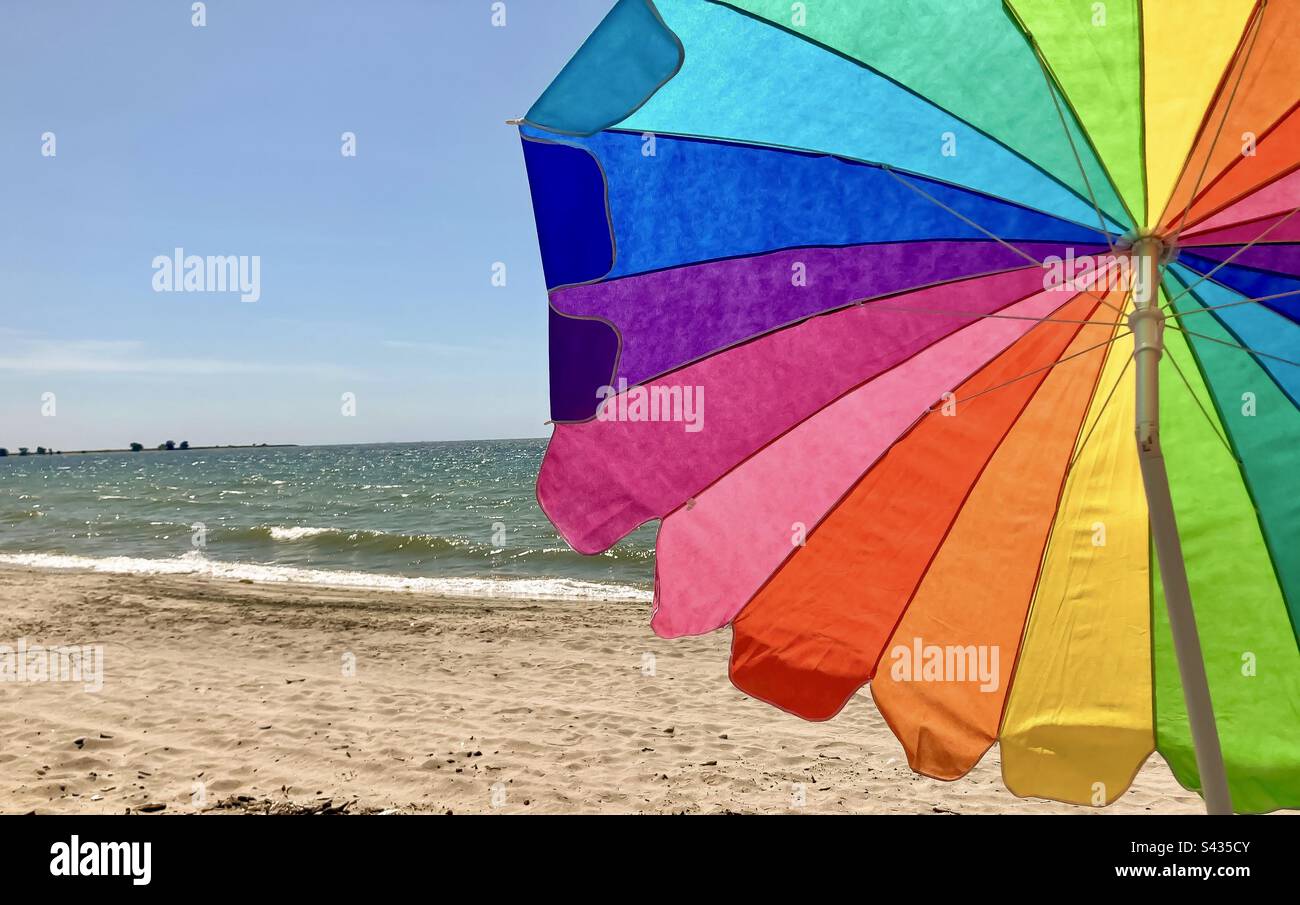 Rainbow beach umbrella hi-res stock photography and images - Alamy