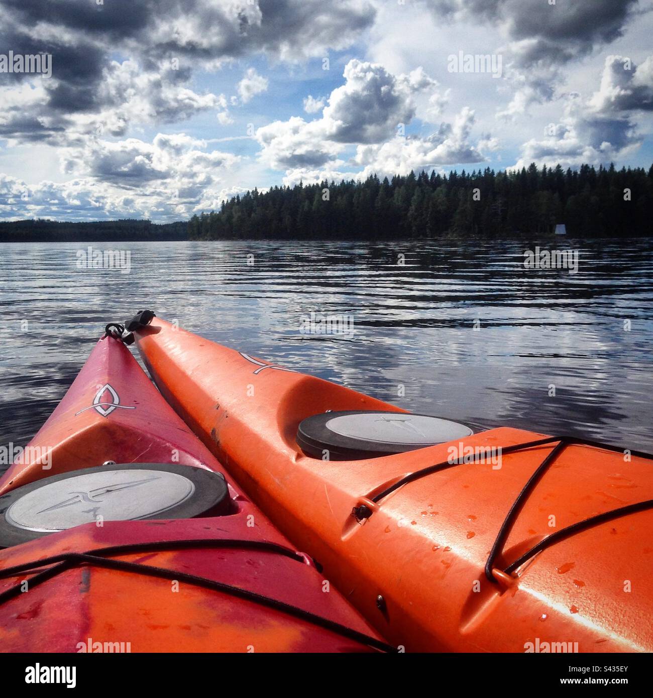 First person view of a two kayaks kayaking at a large lake in the ...