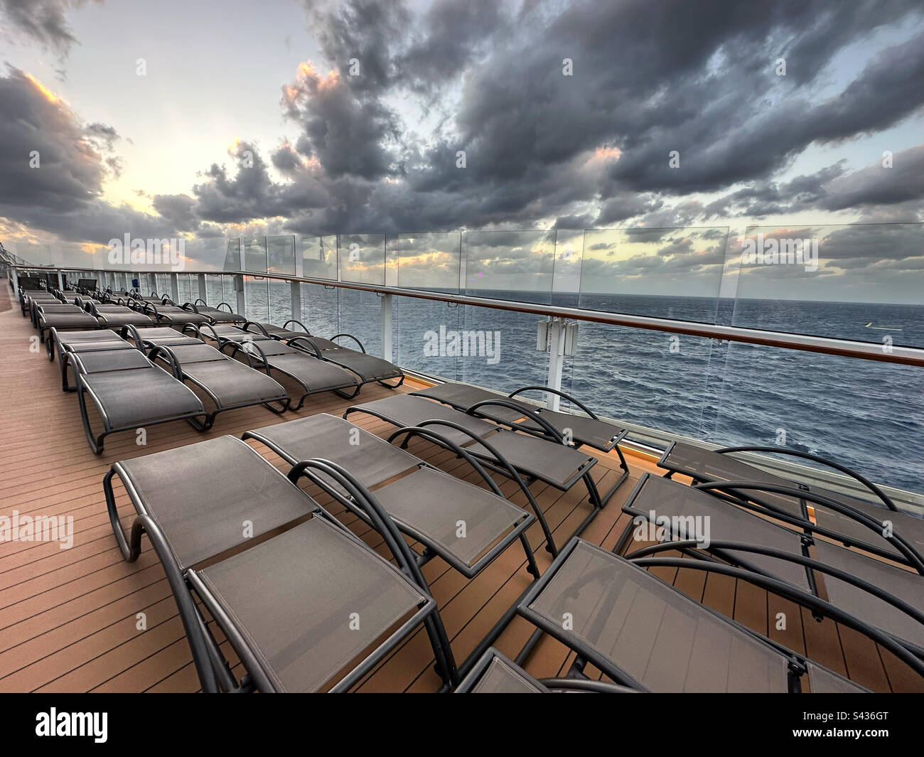 Lounge chairs on a cruise ship deck Stock Photo - Alamy