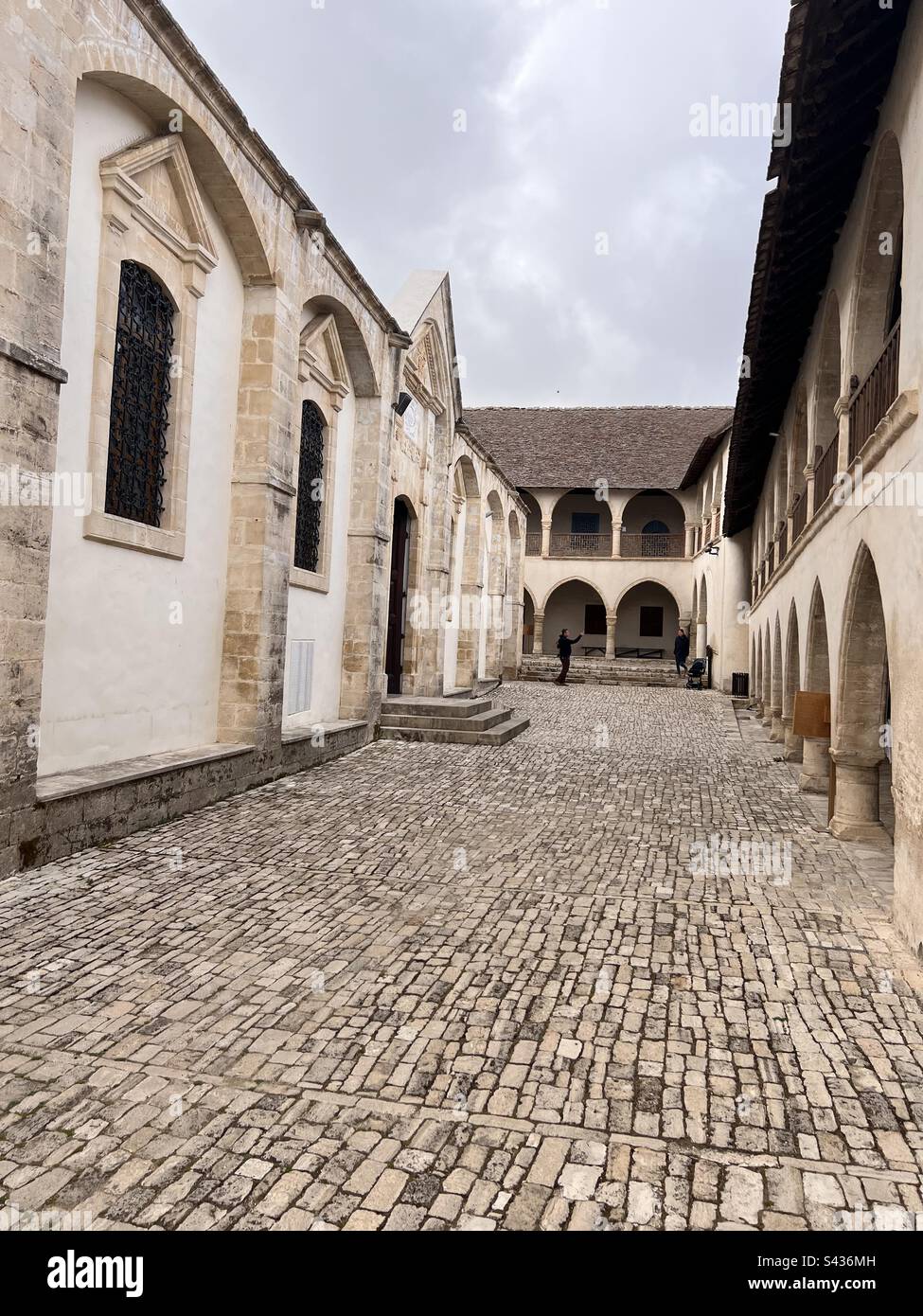 the Holy Cross monastery cobbled street and walls Stock Photo - Alamy