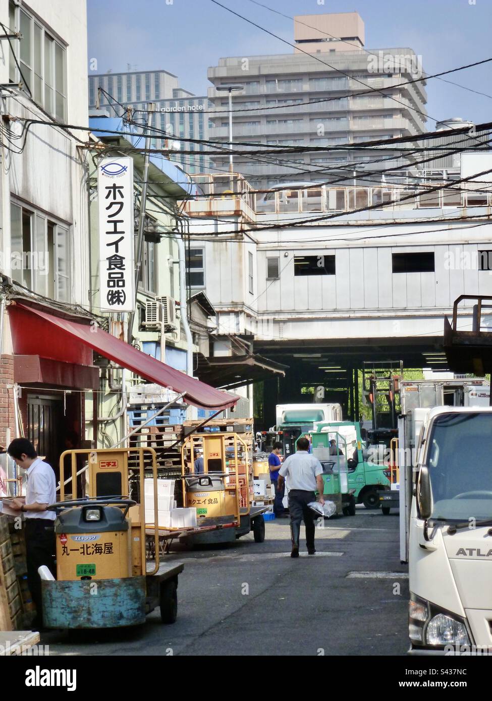 Backstreets of Tokyo in Japan with crazy chaotic wires stretched across ...