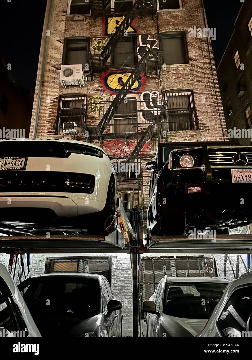 Elevator parking in a neighborhood of New York at night with a view of ...
