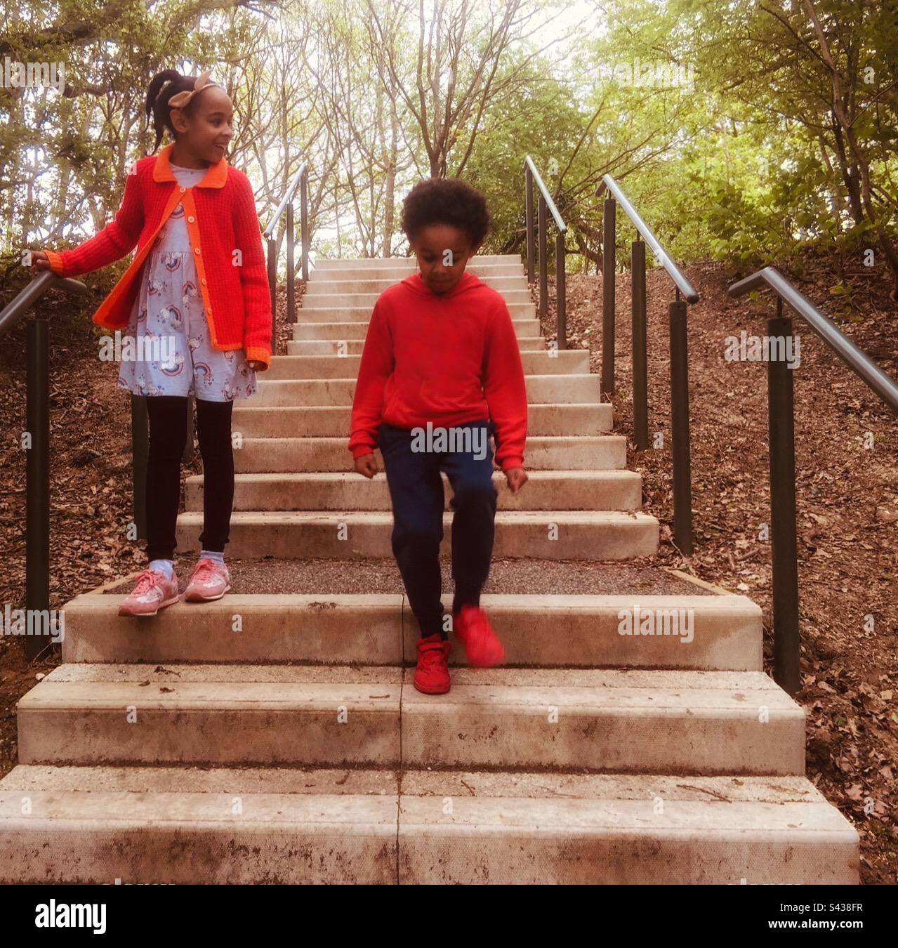 Children walking down steps outdoors Stock Photo - Alamy
