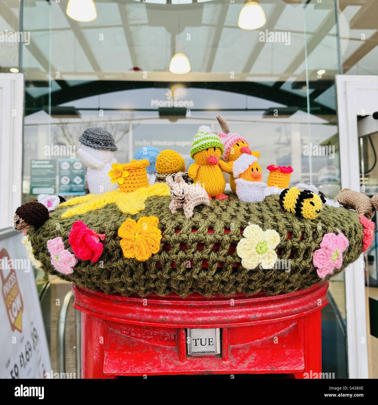 Easter bonnet yarn bombing on a British Royal Mail post box Stock Photo ...