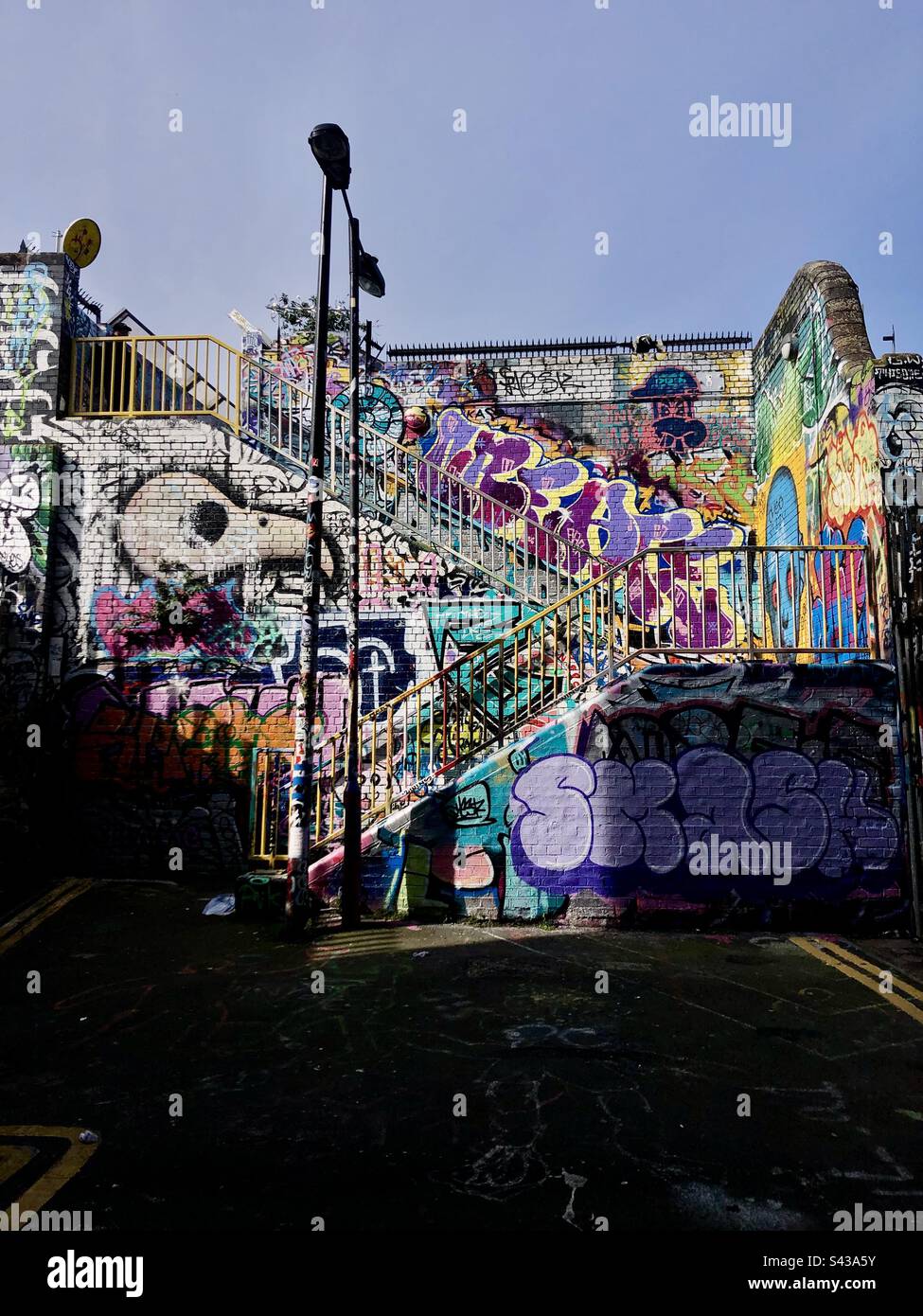Street art graffiti and murals in Shoreditch of east London England Uk ...
