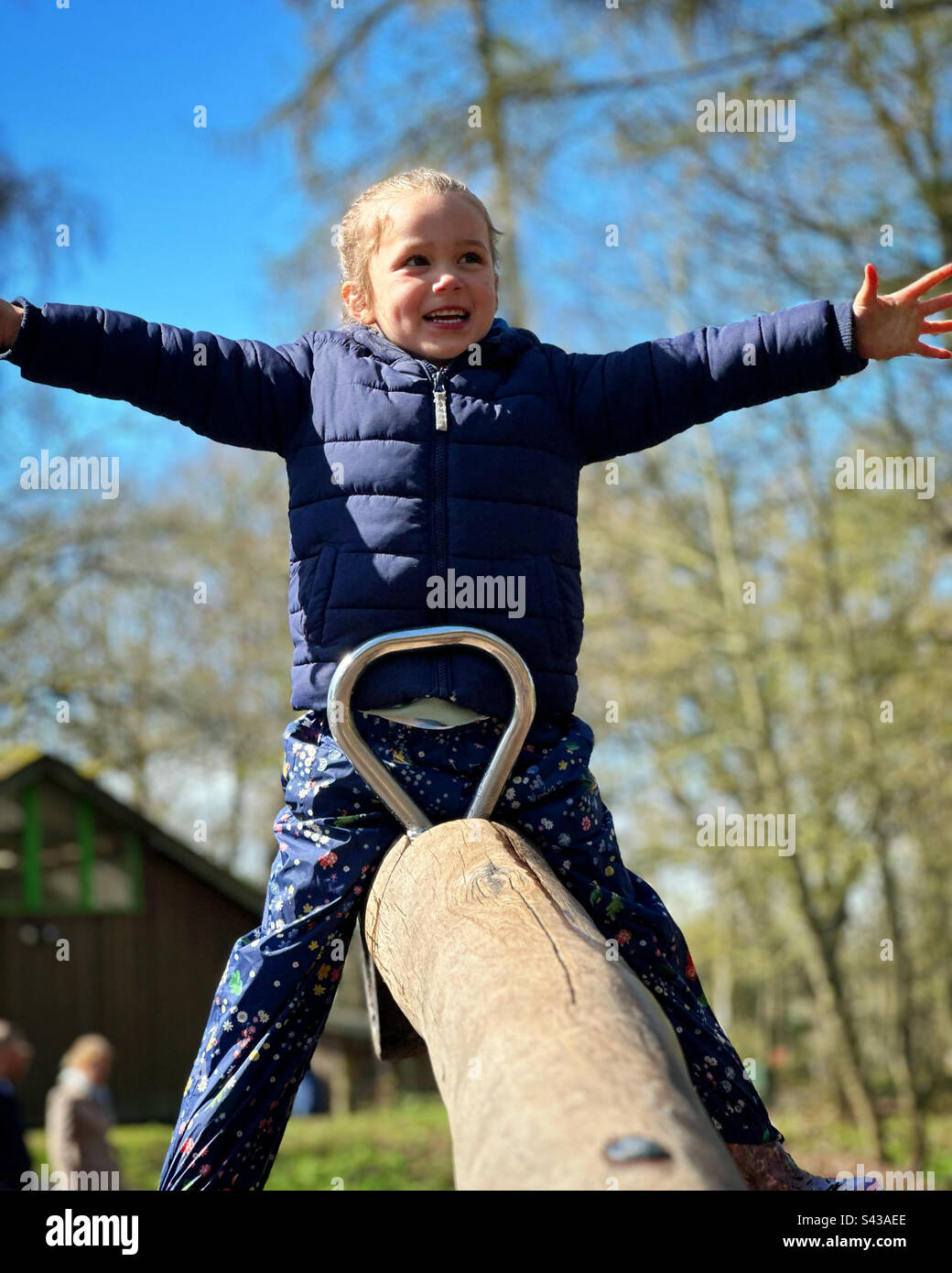Girl having fun on seesaw hi-res stock photography and images - Alamy