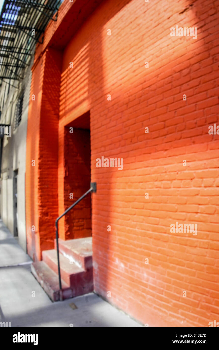 Orange wall steps entrance Stock Photo - Alamy