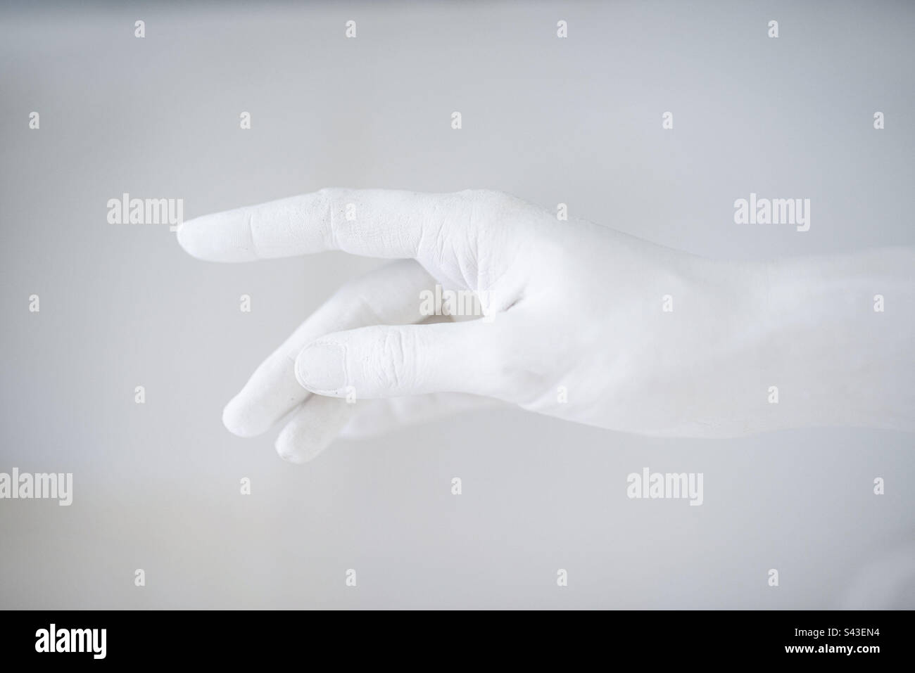 Plaster hand posing with finger slightly pointing Stock Photo - Alamy
