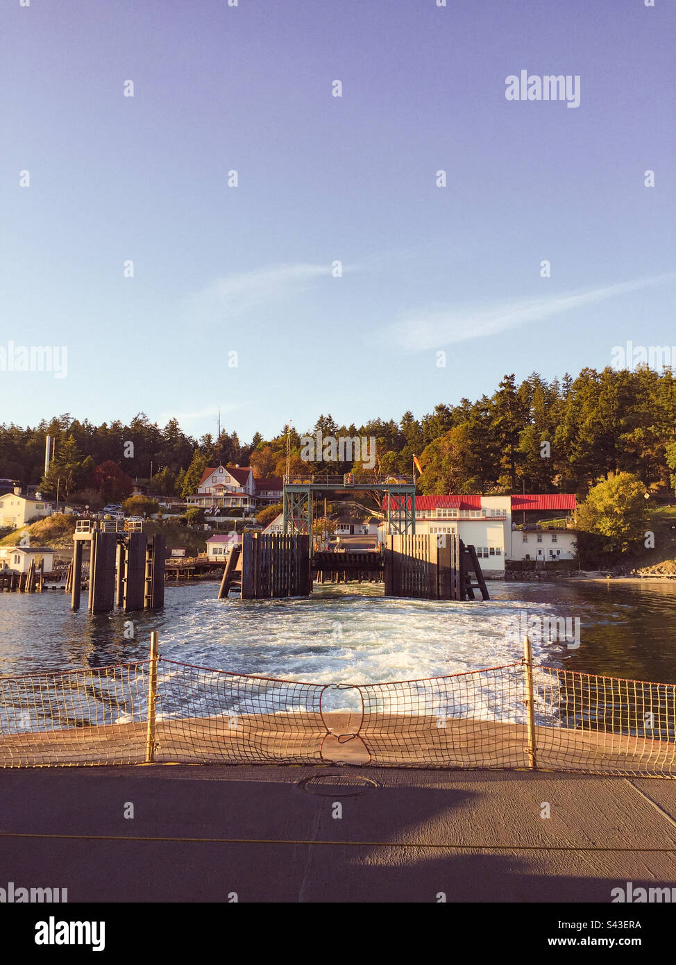 Ferry boat pulls away from the dock on Orcas Island, Washington State ...