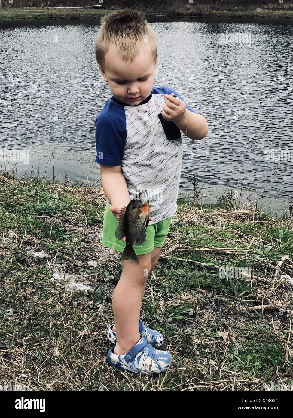 Boy with his catch hi-res stock photography and images - Alamy