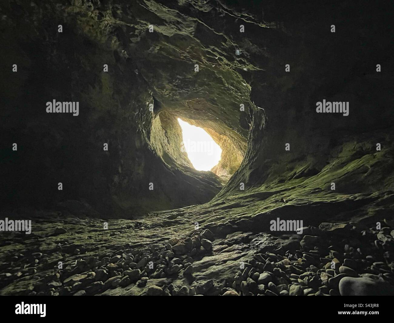 View from inside Paviland cave looking towards the exit, Swansea, Gower ...