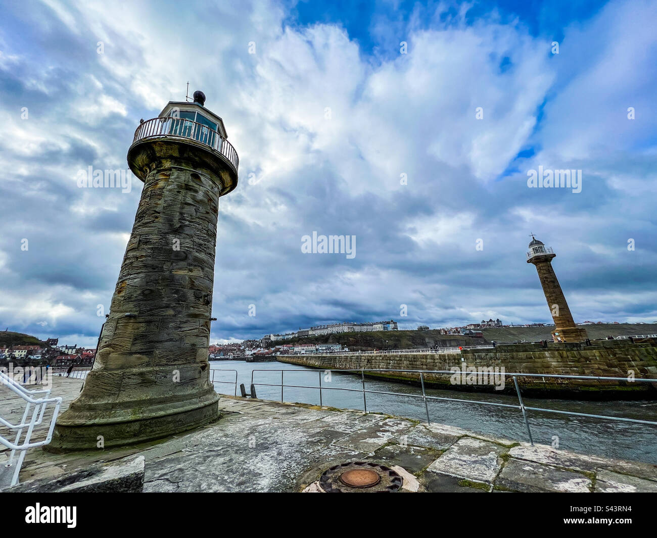 Whitby harbour lighthouse and pier Stock Photo - Alamy