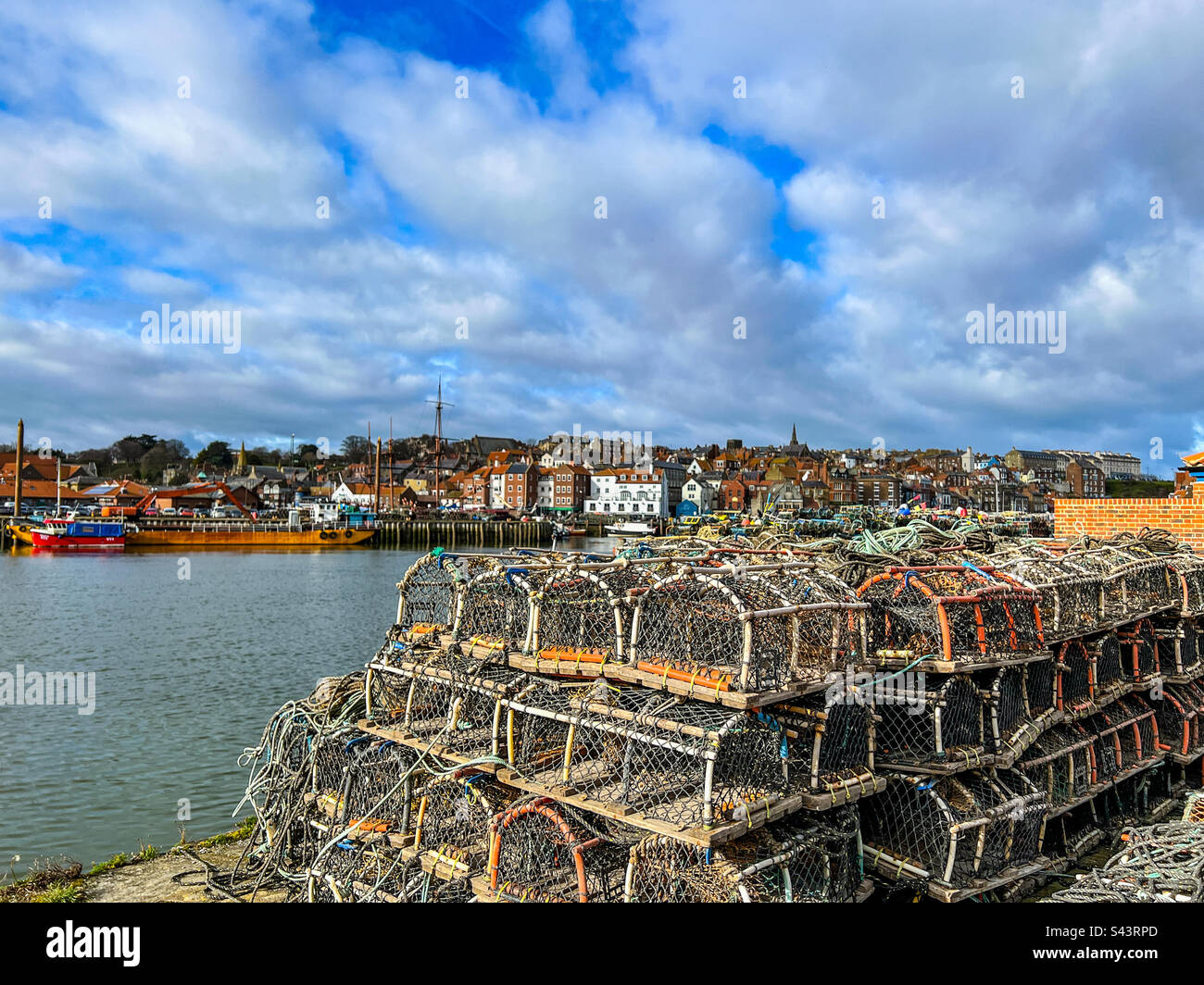 Stacks of lobster boxes on the river esk in Whitby Stock Photo - Alamy
