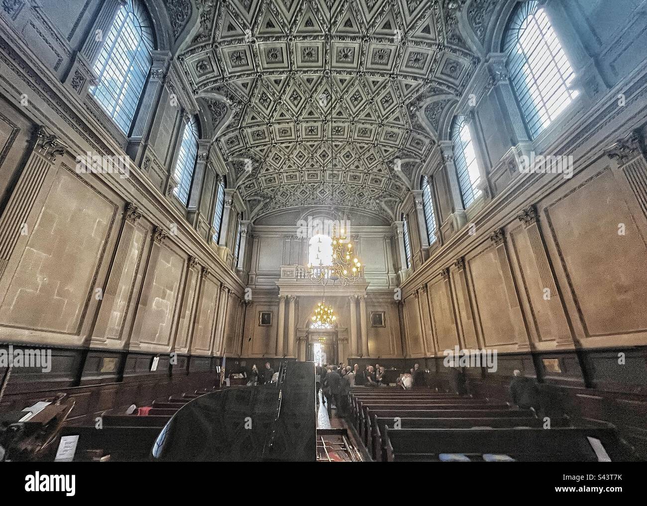 Looking down the aisle, congregation approaches the door at St Mary Le ...