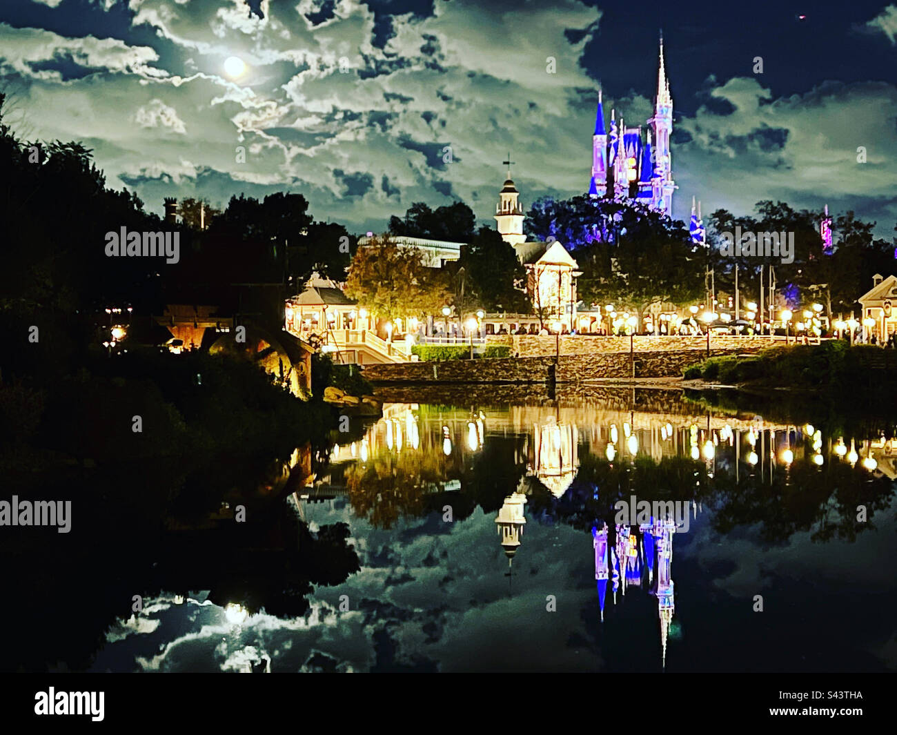 Beautiful full moon over reflection in a river of castle and mansion in ...