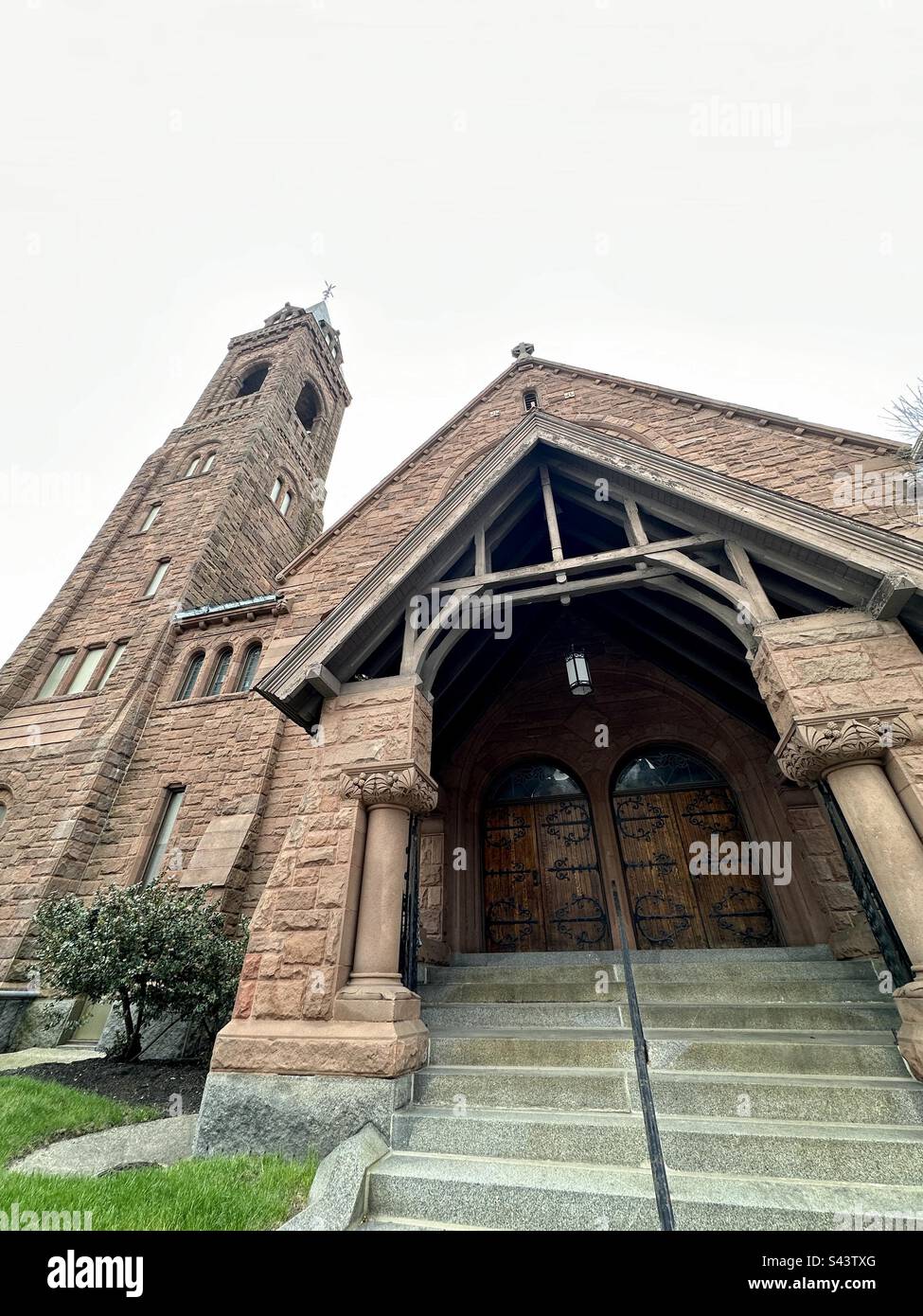 Worcester, Massachusetts, USA: Exterior of entrance to red stone church ...