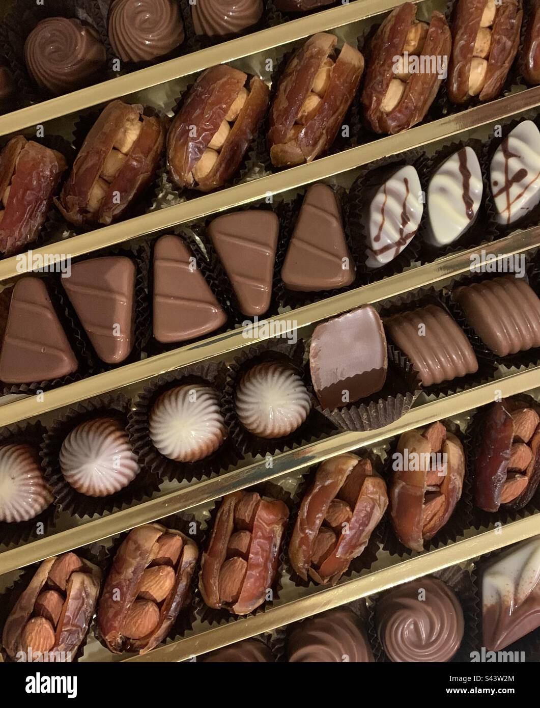 Closeup image of an assorted gift box of chocolates and dates Stock ...