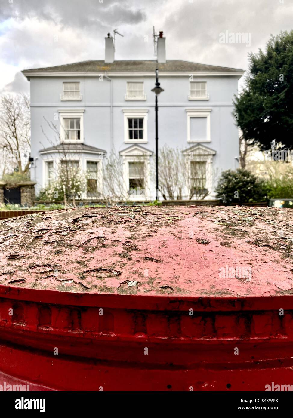 Pink on postbox in front of house, London Stock Photo - Alamy