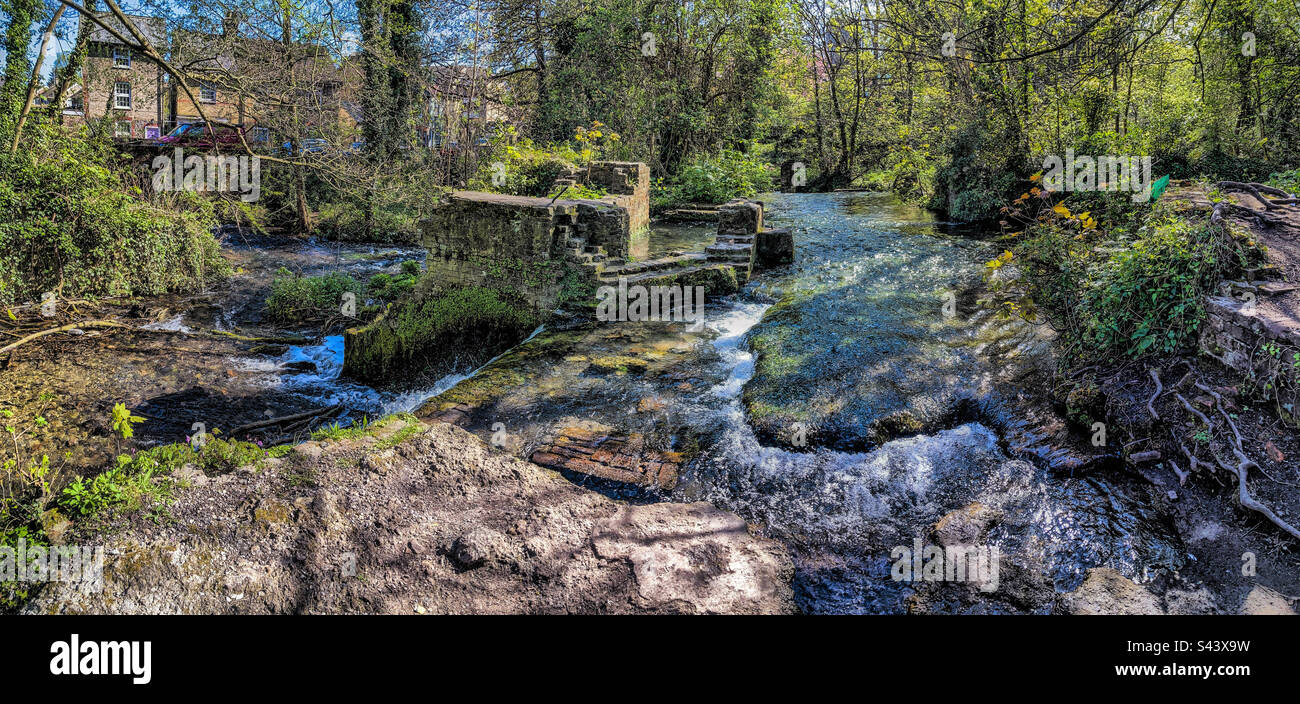 Ruins of an old paper mill, on the River Dour, in the grounds of ...
