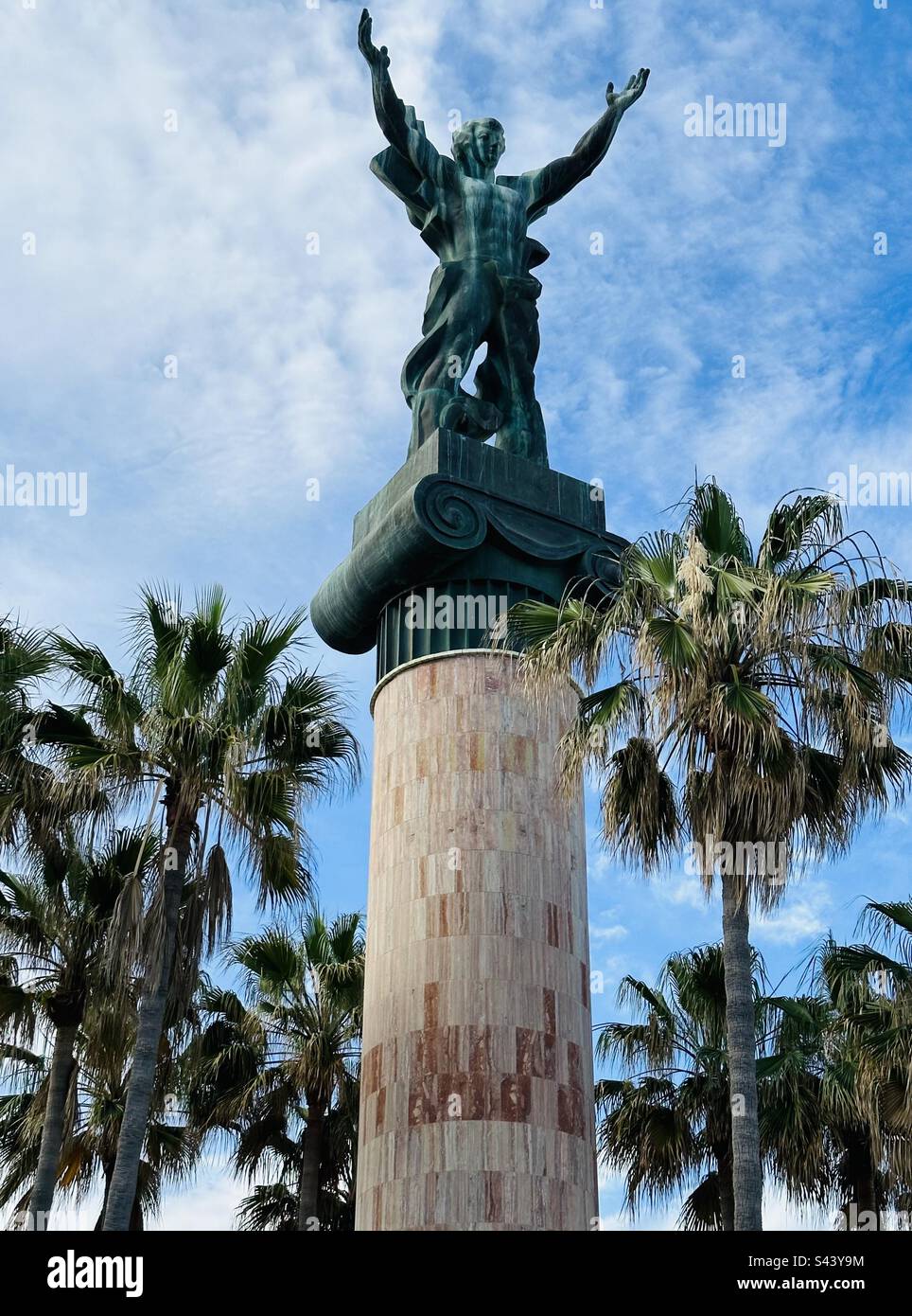 Statue of Jose Banus on a tall granite column near the entrance to ...