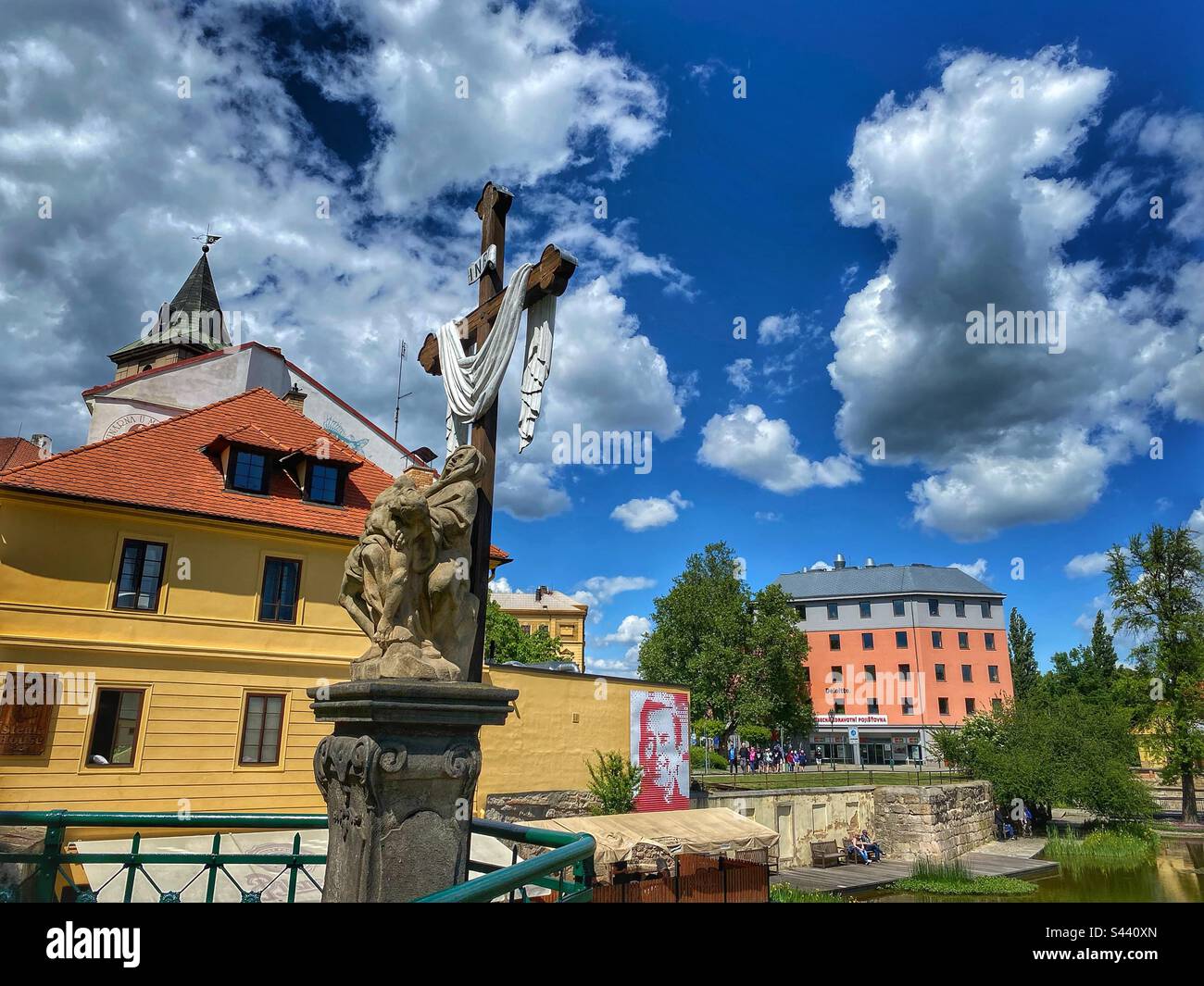 Big cross stone statue with white clouds and blue sky in the historical ...