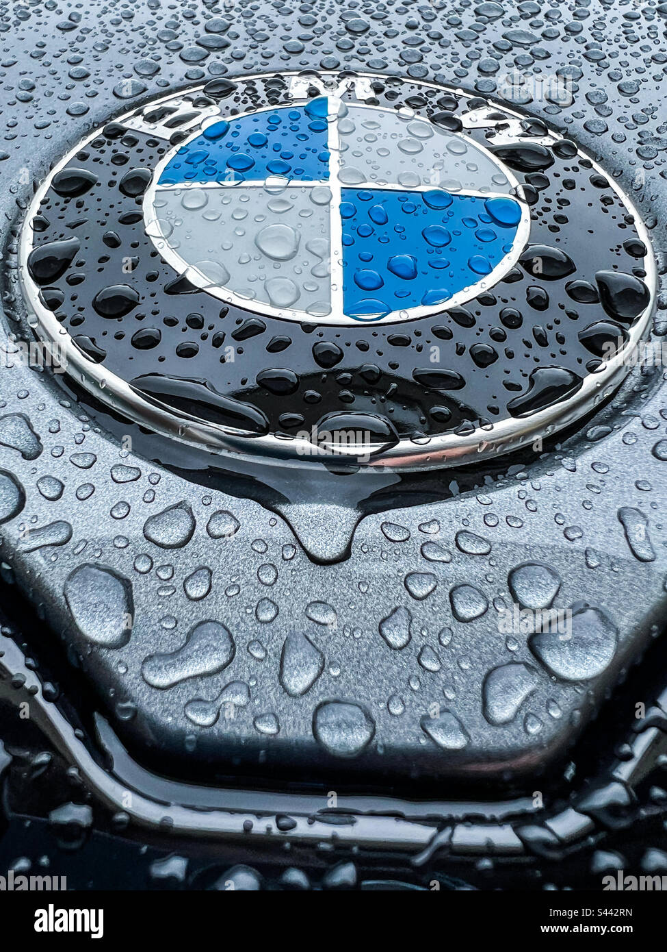 BMW badge with rain drops Stock Photo - Alamy