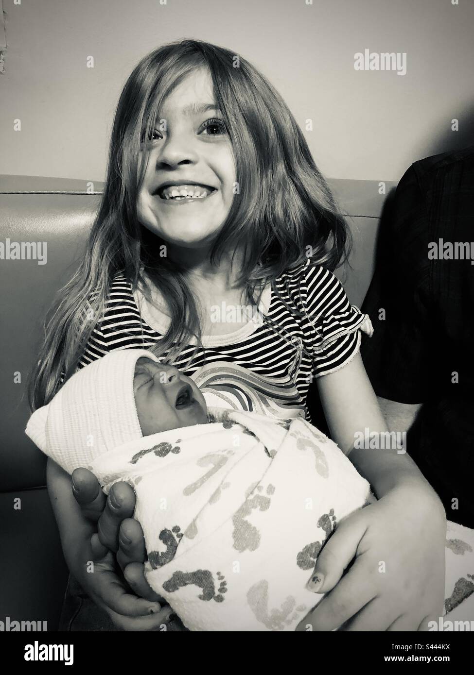 Happy little girl holding her newborn baby brother Stock Photo - Alamy Happy little girl holding her newborn baby brother Stock Photo - Alamy
