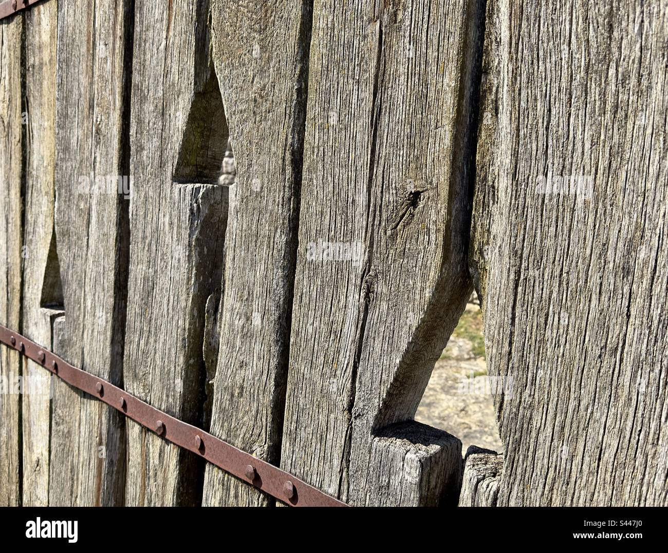 Triangular Apertures In A Wooden Screen Intended To Protect Mediaeval