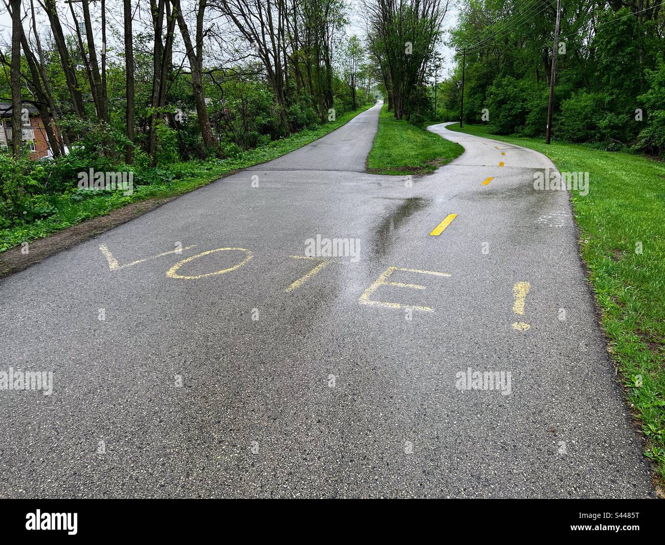 Bike path reminder to vote, with a choice to go left or right Stock ...