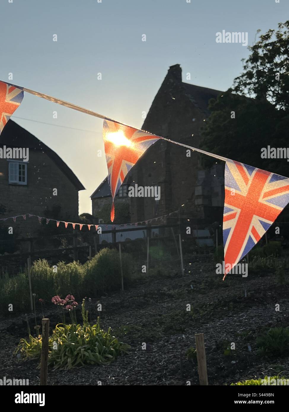 Union Jack flags cut into triangular bunting for the coronation, May ...