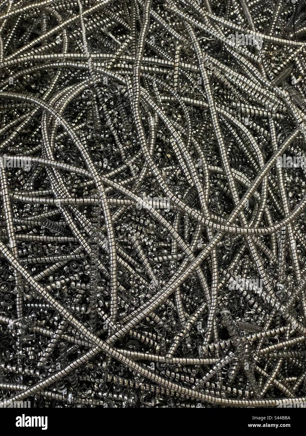 Waste metal shavings in recycling collector Stock Photo - Alamy