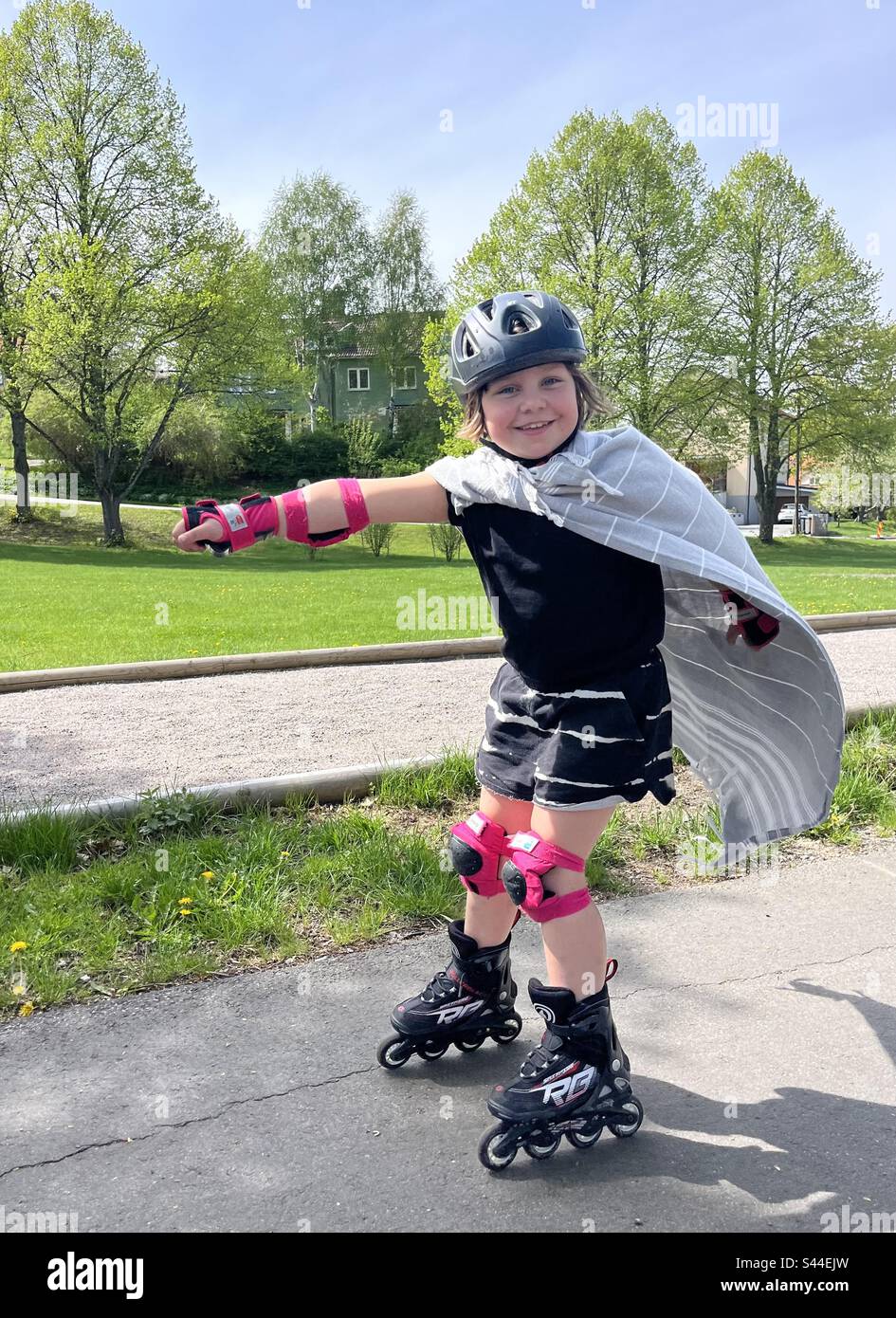 Rolling skating child Stock Photo - Alamy