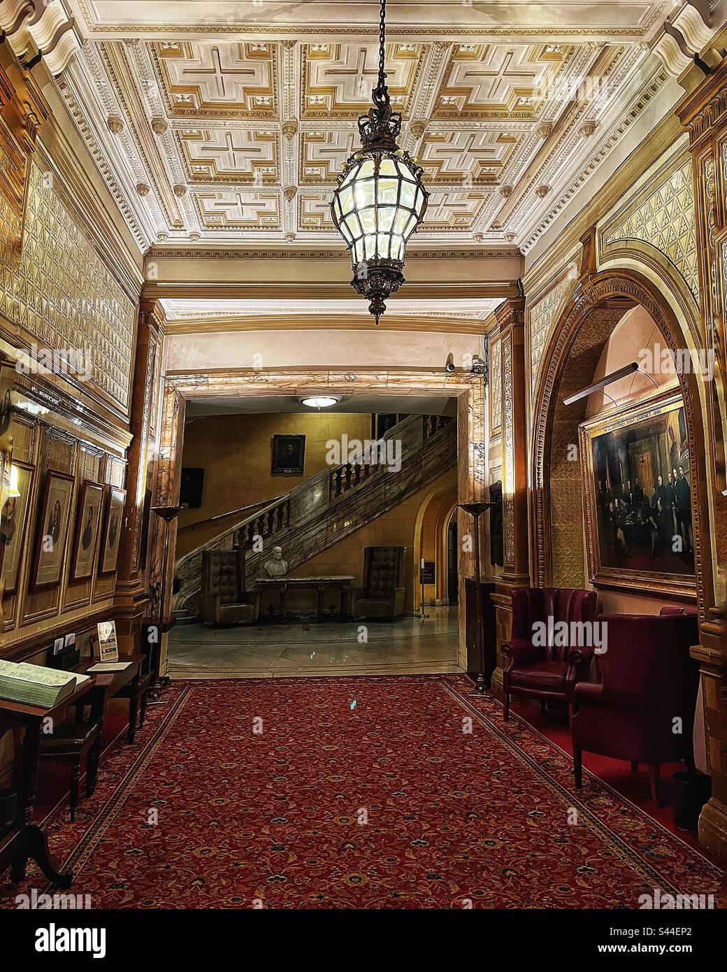 Lamp hangs from the ceiling at the National Liberal Club with the grand ...