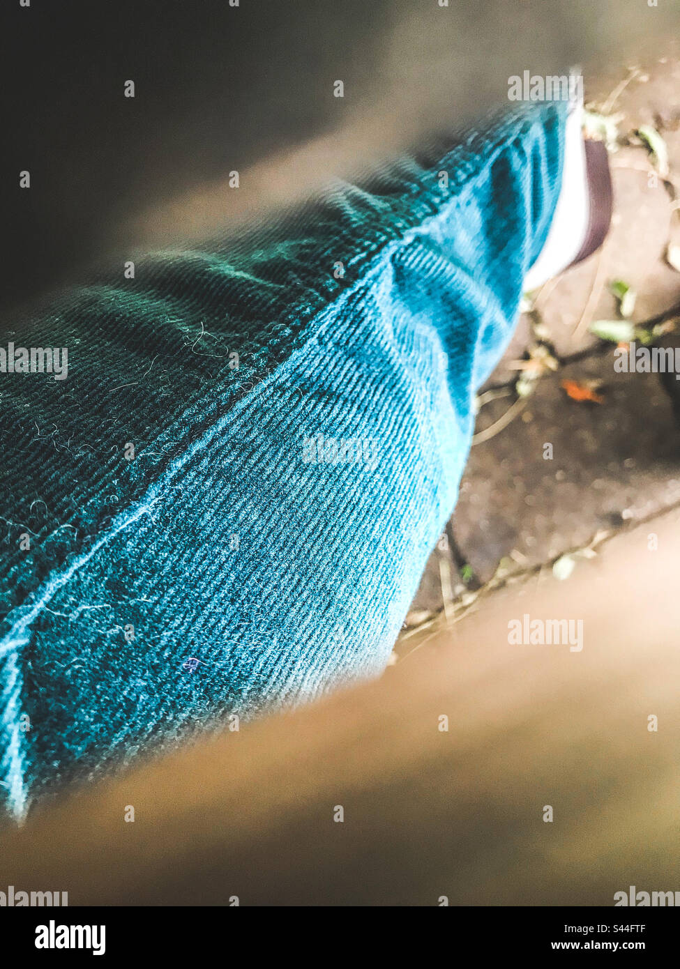 Glimpse of a denim clad leg Stock Photo - Alamy