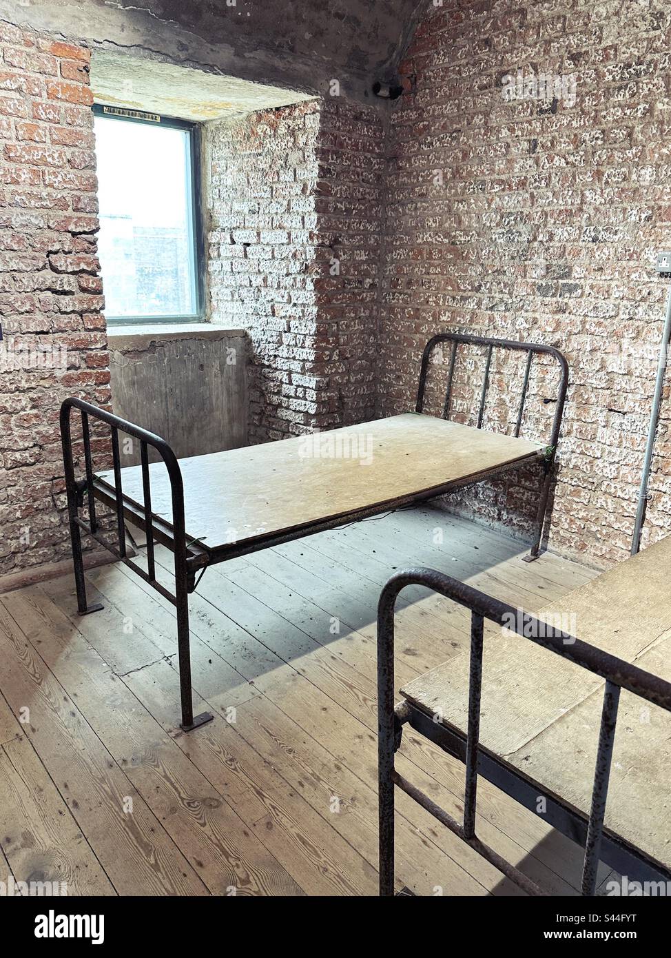 Bed frames in an old prison cell on Spike, Island in Cobh, Ireland ...