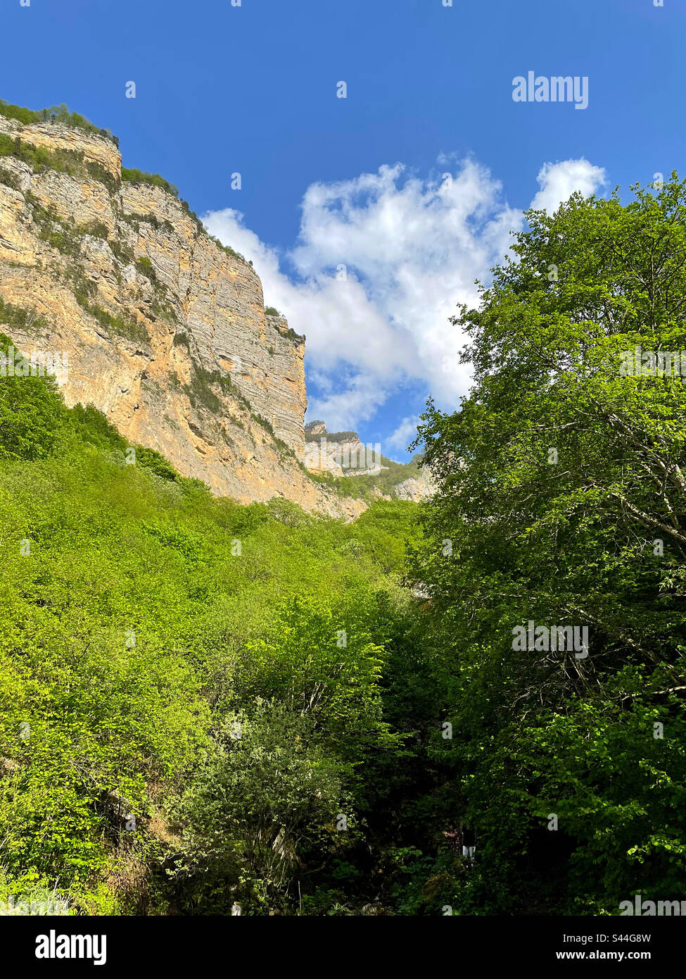 small cloud between mountain peaks Stock Photo - Alamy