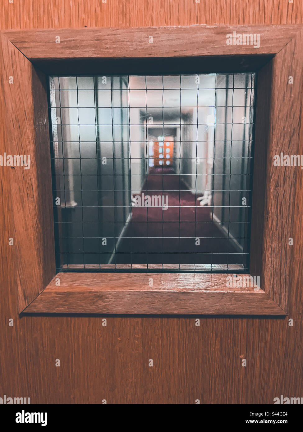 Hotel corridor through a window Stock Photo - Alamy