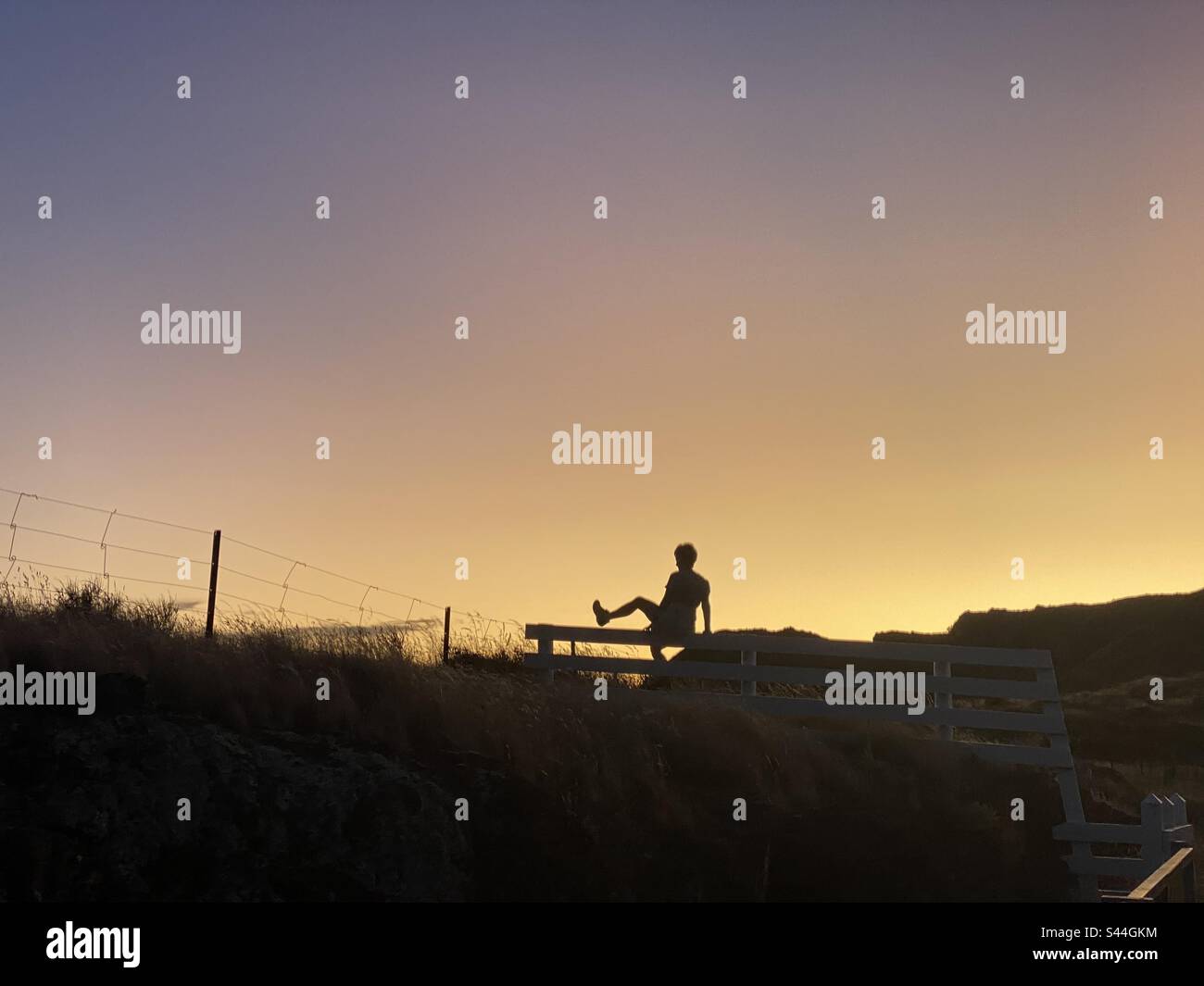 Climbing over a fence hi-res stock photography and images - Alamy