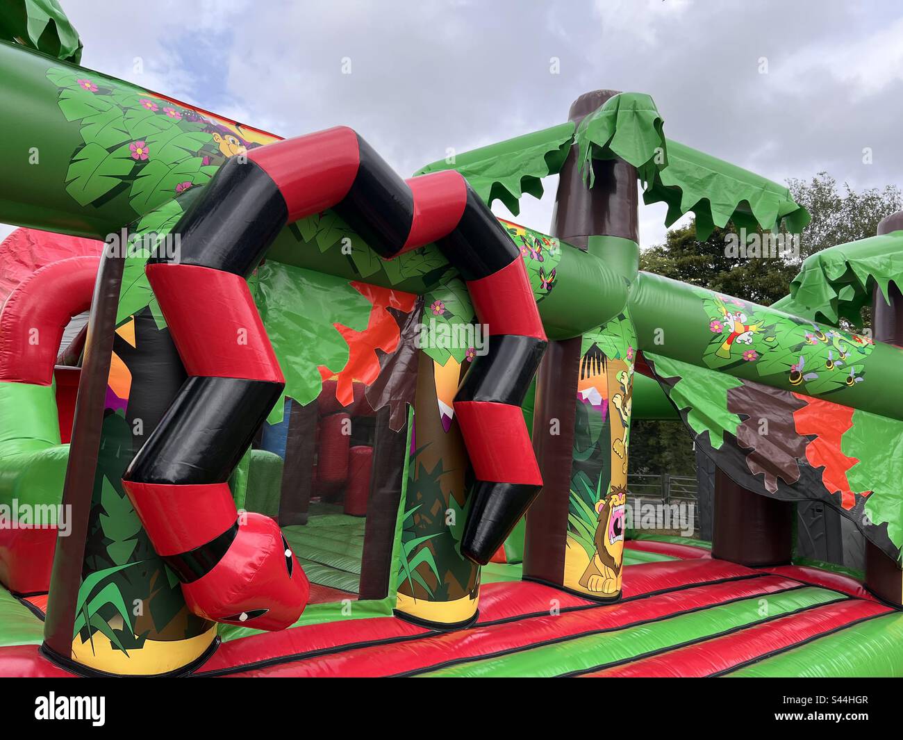 Spider inflatable bouncy castle at a fun fair Stock Photo - Alamy