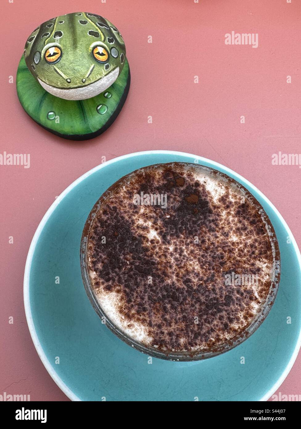 Marocchino coffee with a hand painted stone frog at the bar Stock Photo ...