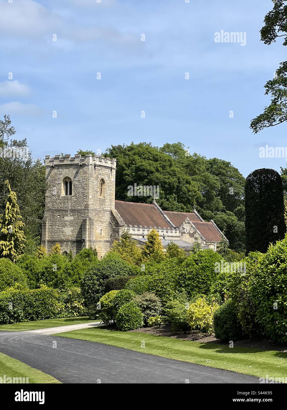 Brodsworth Hall church and beautiful green gardens Stock Photo - Alamy