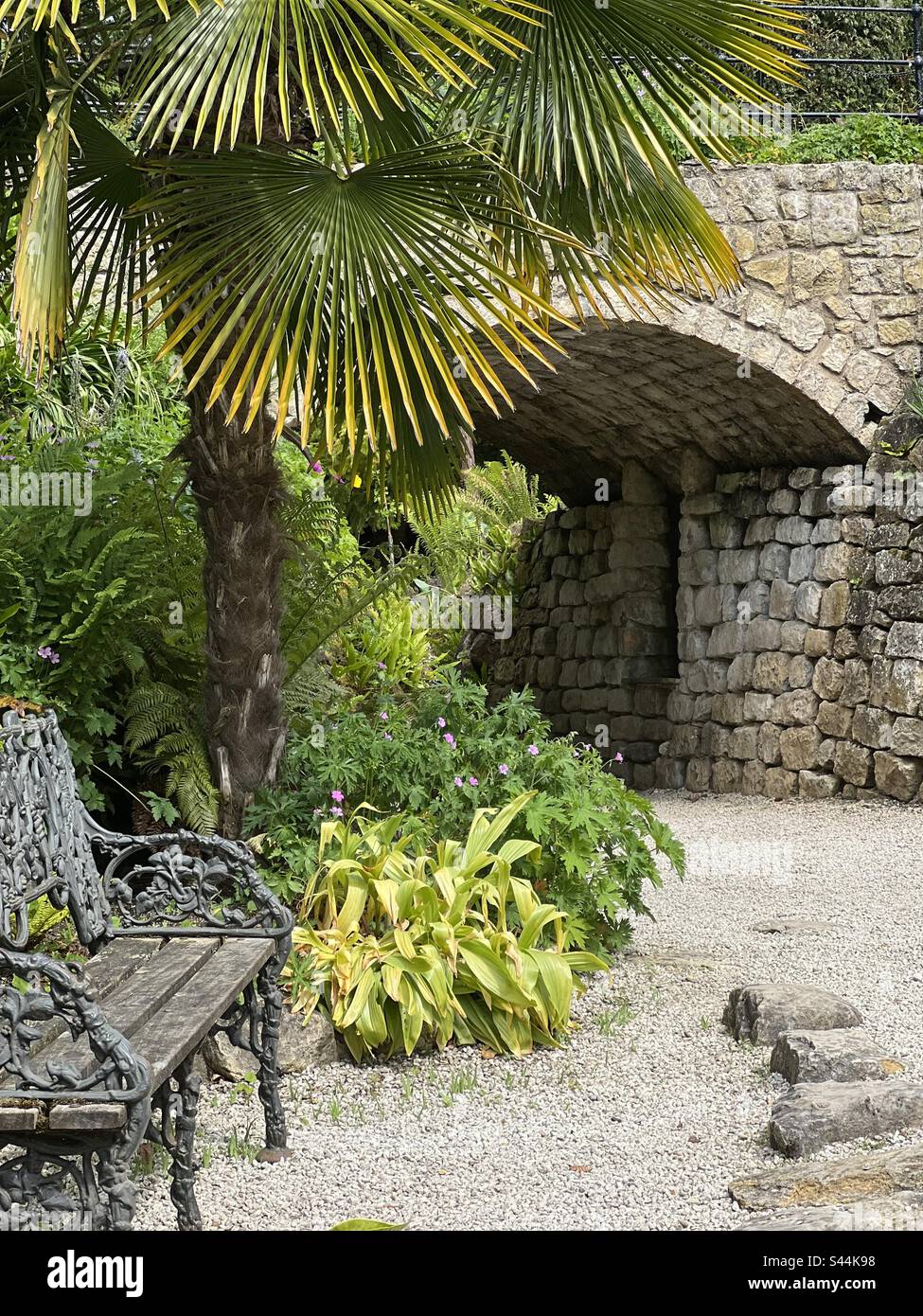 Brodsworth Hall fern gardens view towards a stone bridge Stock Photo ...