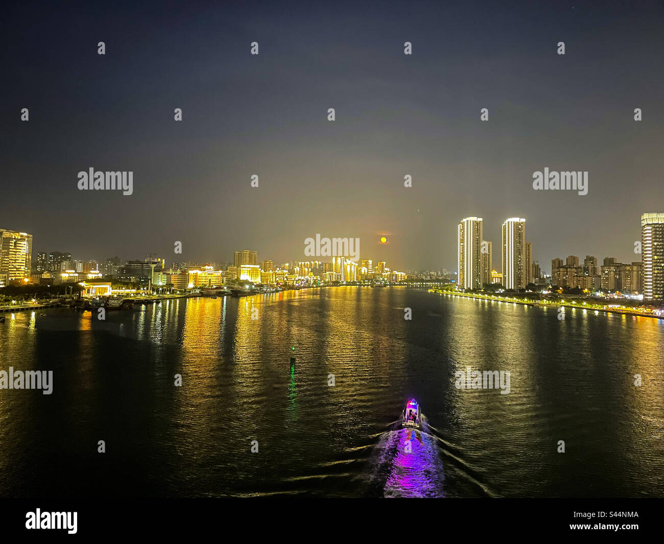 Full moon over ocean Stock Photo - Alamy