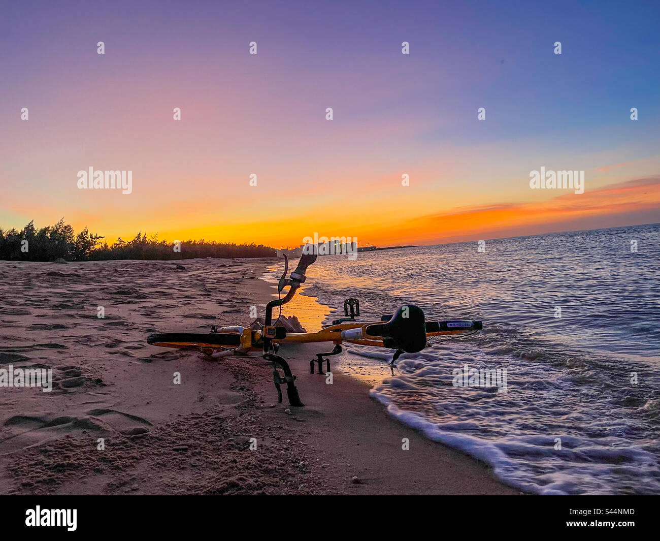 Rental bike on beach Stock Photo - Alamy