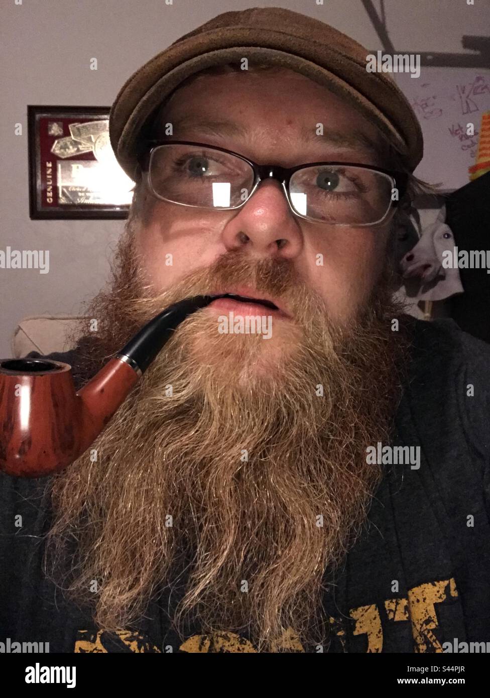 Man with pipe and cap hi-res stock photography and images - Alamy