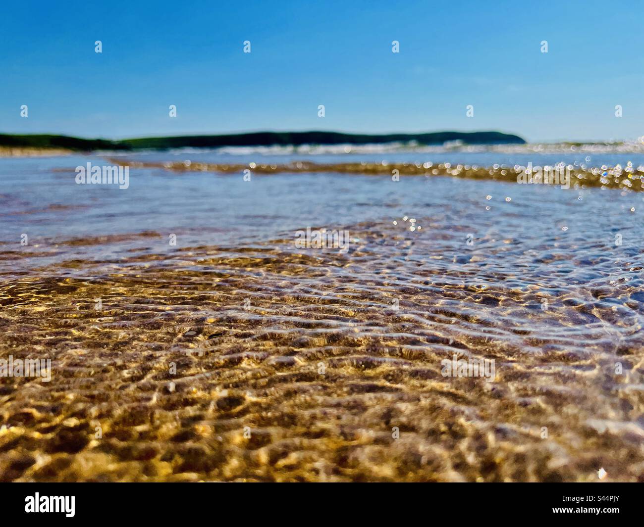 Waves lapping shore close up hi-res stock photography and images - Alamy