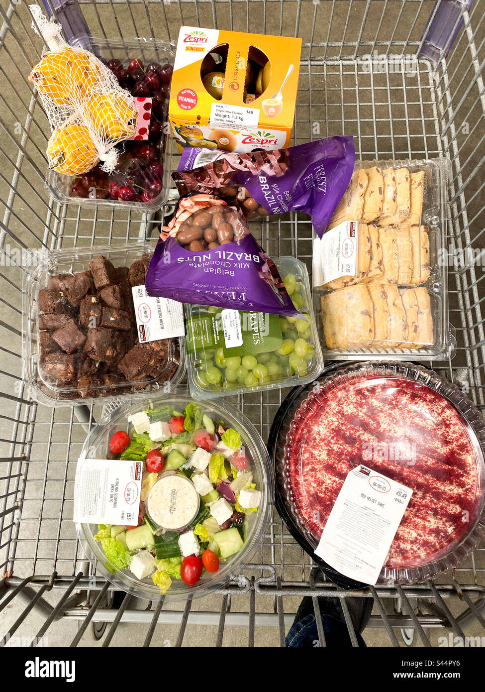 Goods in a supermarket trolley Stock Photo - Alamy